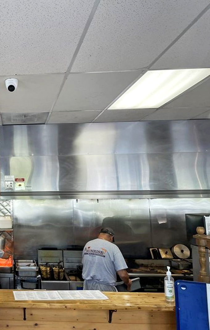 Behind the scenes, where burgers become legends. No molecular gastronomy here—just time-honored techniques and a well-seasoned grill.