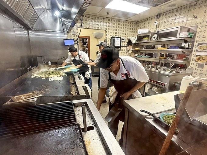 Behind the scenes, the kitchen crew works their magic – turning simple ingredients into the Tex-Mex treasures that keep Austin coming back.