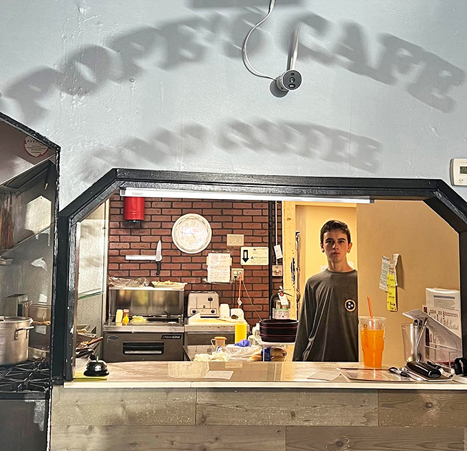 The pass-through window where culinary magic materializes—simple ingredients transformed into the comfort food that keeps locals coming back for decades.