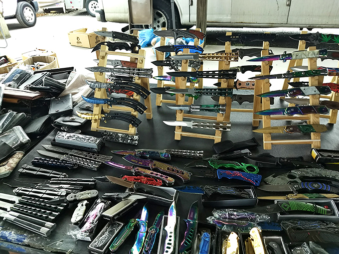 Blade enthusiasts find paradise in this carefully arranged display. From practical everyday carries to decorative showpieces, these knives cut through the ordinary shopping experience.
