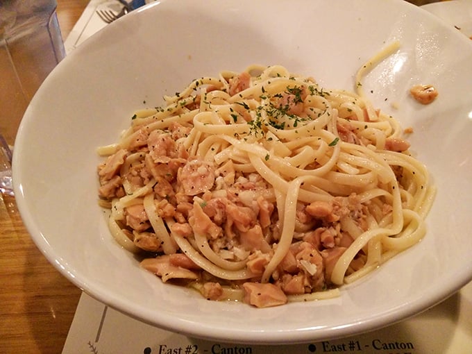 Linguini with clam sauce that speaks volumes—tender pasta strands mingling with savory seafood in a dish that transports you straight to coastal Italy.