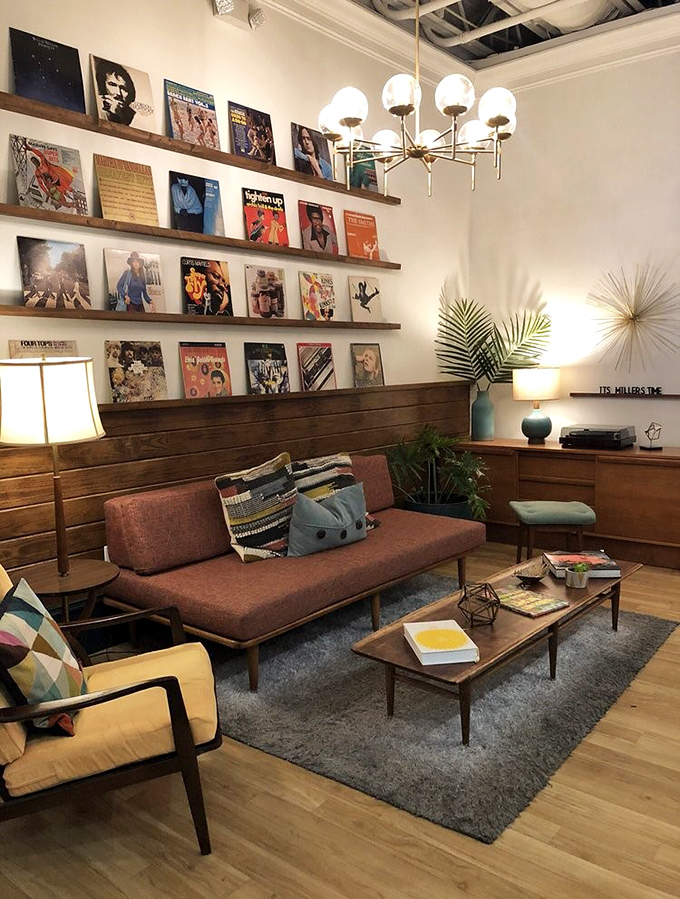 The lounge area's vinyl collection and mid-century furniture create a space where time slows down and another coffee seems inevitable.