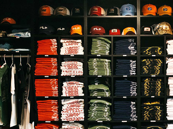 The merch wall isn't just clothing—it's a chance to join the barbecue brotherhood and spread the gospel of good eating wherever you go.