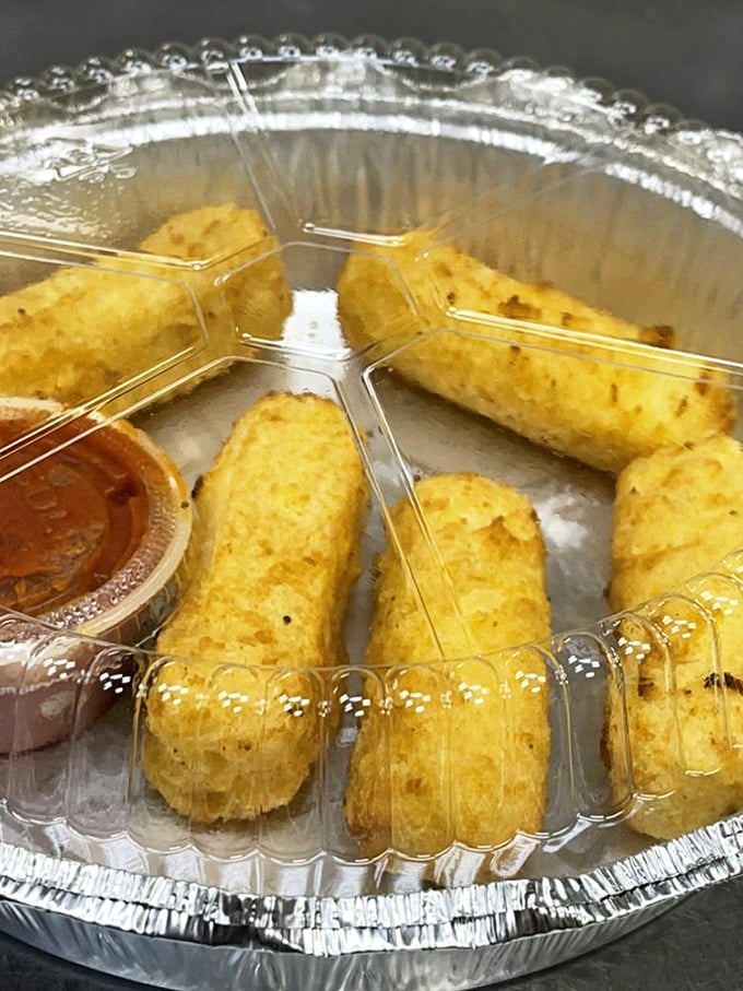 Mozzarella sticks arranged like the spokes of a delicious wheel. Each golden-brown cylinder promises a perfect cheese pull moment.
