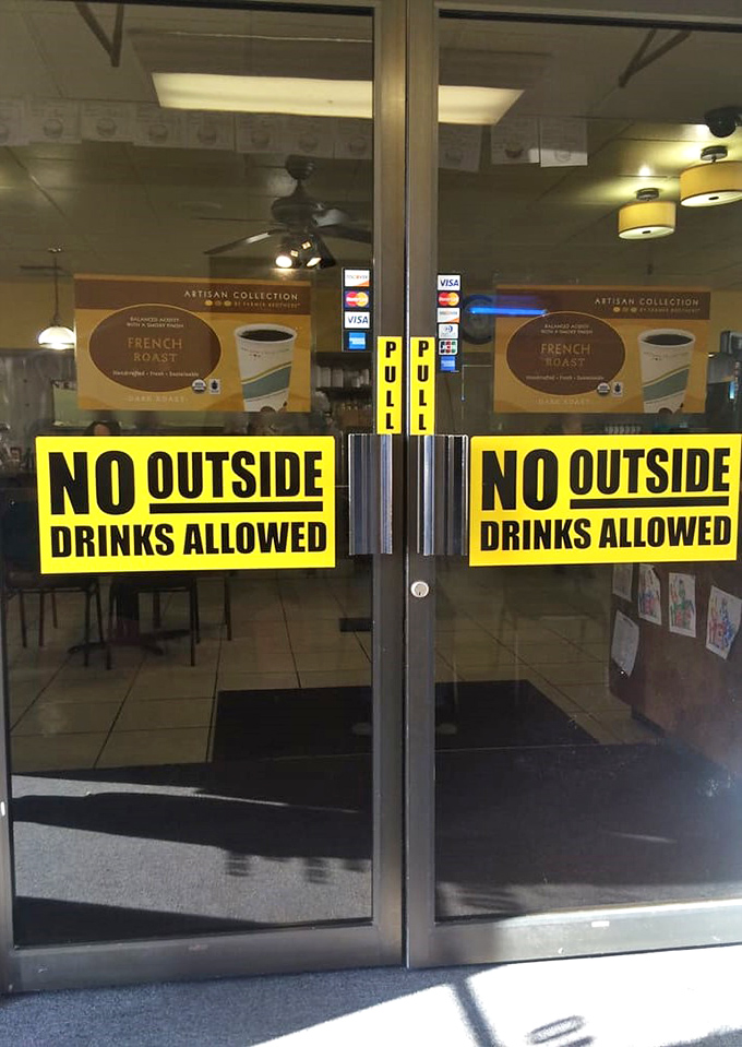 The "No Outside Drinks" sign—a small reminder that this establishment takes its beverage program seriously, thank you very much.