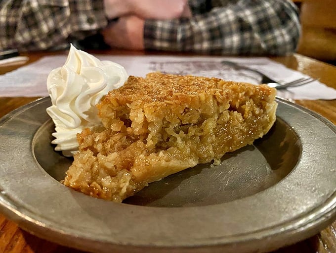Oatmeal pie that would make Betsy Ross put down her needle—sweet, nutty perfection topped with a cloud of whipped cream that deserves its own flag.