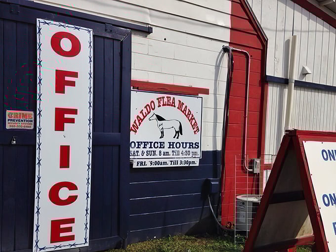 The office hours sign features the market's equine mascot – because nothing says "flea market" quite like a horse on a building.