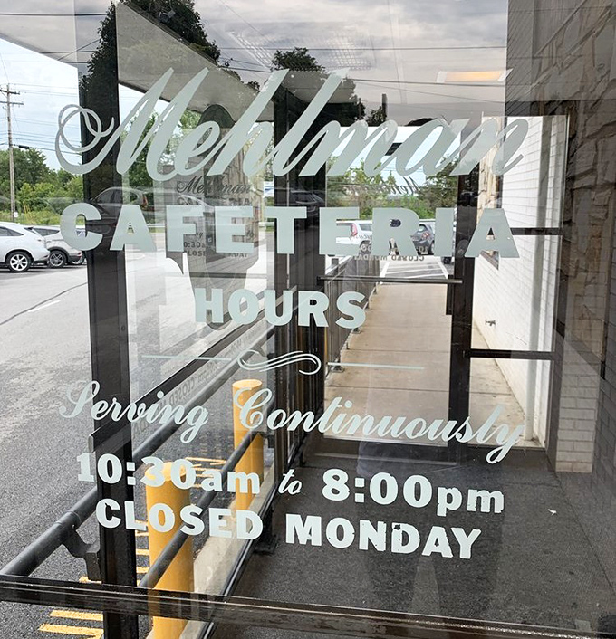Hours posted on glass like a promise – "We'll be here when you need comfort food therapy."