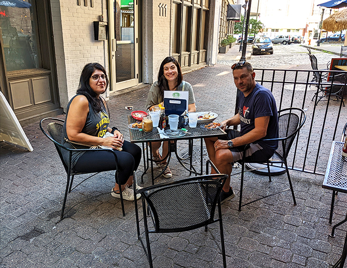 The outdoor patio offers prime people-watching on cobblestone streets—a perfect urban oasis for enjoying Maryland's fleeting perfect weather days.