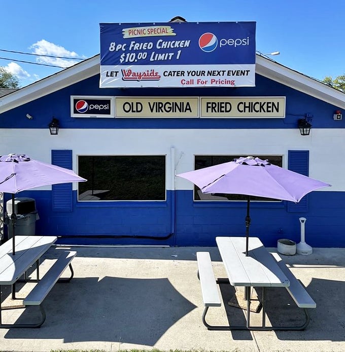 Picnic tables under purple umbrellas—summer's perfect stage for chicken feasts. Even sunshine knows to show up for Wayside's outdoor dining experience.