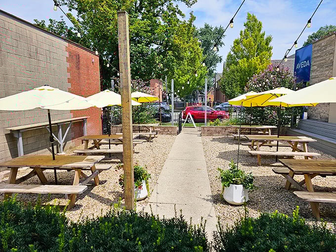 The outdoor patio: where summer afternoons turn into evening feasts. Those yellow umbrellas are beacons calling you to barbecue bliss.