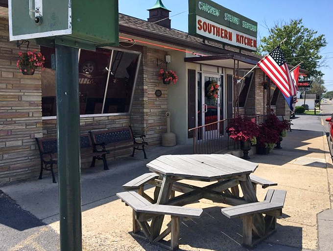 Outdoor seating where the mountain air makes everything taste better, complete with American flag fluttering like the restaurant's own seal of authenticity.