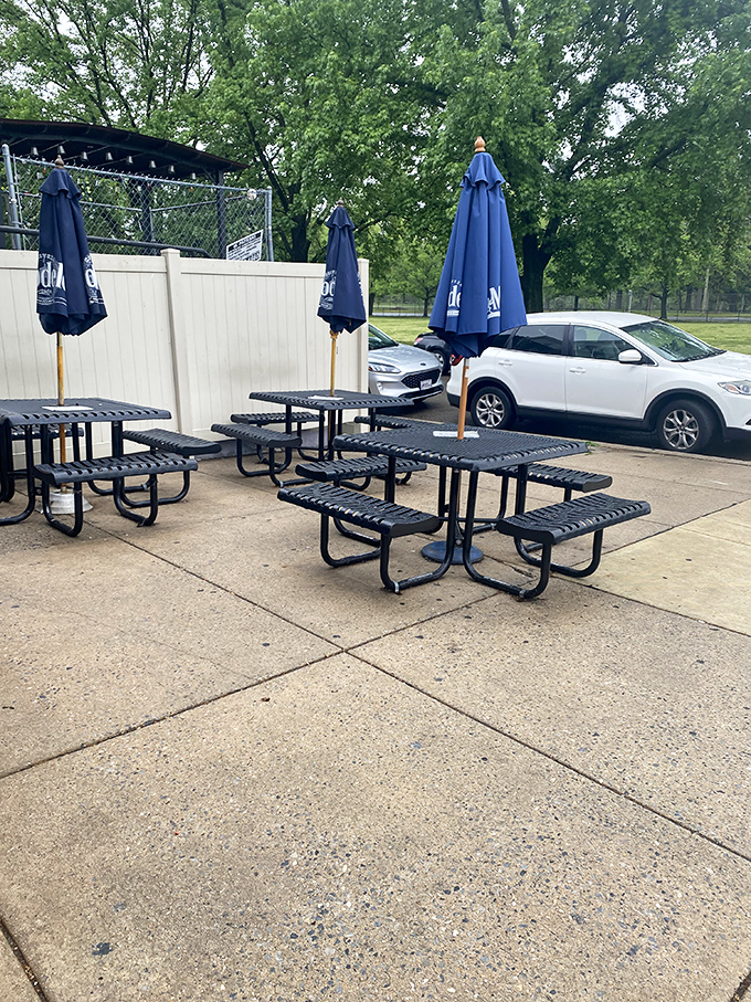 The outdoor seating area awaits its hungry guests, like a theater before the curtain rises on the main performance.