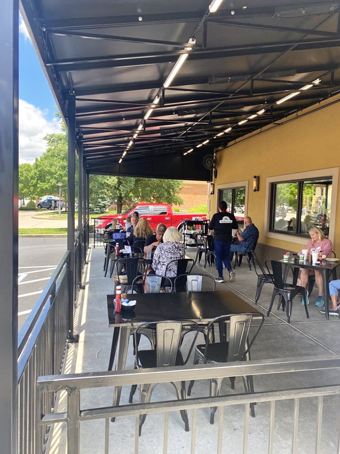 Outdoor seating where the morning air enhances the flavor of every bite—nature's own secret ingredient.