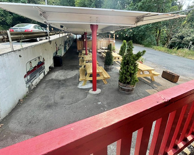 A different angle of the outdoor seating area—where picnic tables await your burger pilgrimage. Simple pleasures in the Portland hills.