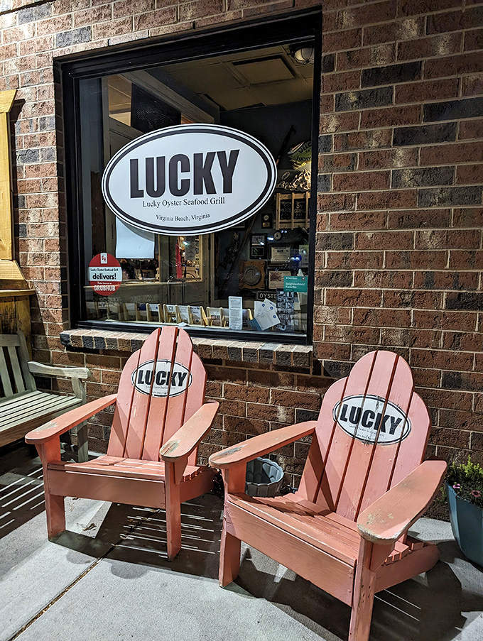 Those coral-colored Adirondack chairs aren't just seating – they're an invitation to linger a little longer in seafood paradise.