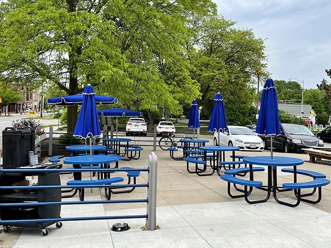 Outdoor dining with a distinctly Wisconsin touch – those blue umbrellas have sheltered countless conversations over coffee and pie throughout Madison's seasons.