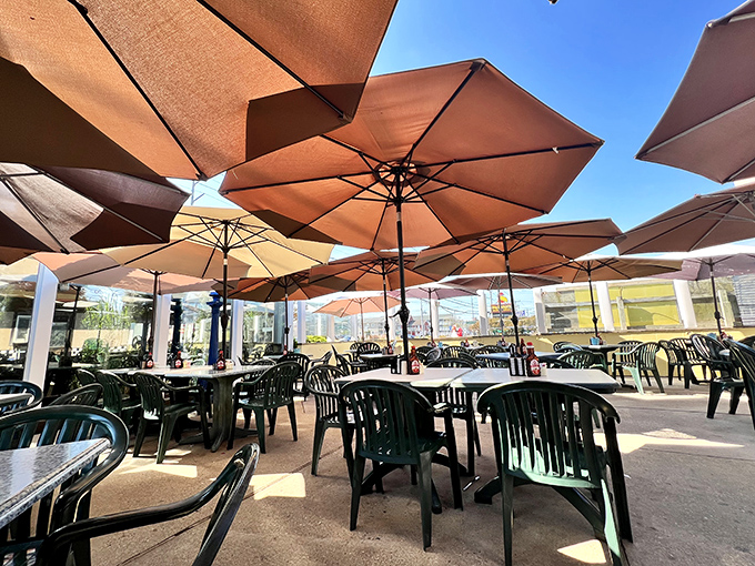 Outdoor seating under beach umbrellas—because sometimes pancakes taste even better with a side of sunshine.