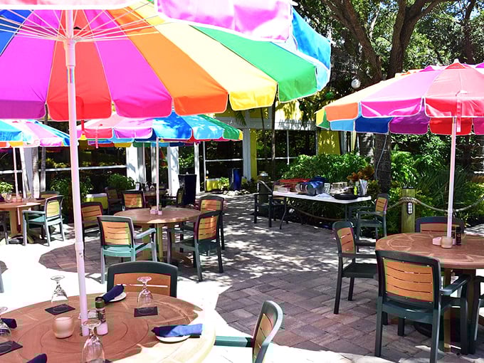 Outdoor dining under rainbow umbrellas creates the perfect Florida moment—casual, colorful, and with just enough shade to keep your key lime pie from melting too quickly.