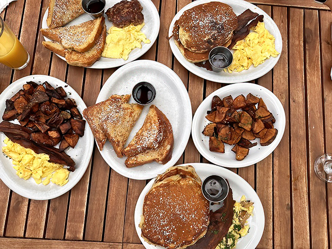 A breakfast spread that would make Ron Swanson weep with joy—golden pancakes, perfect eggs, and potatoes that redefine "home fries."