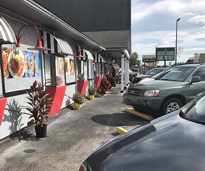 The exterior walkway hints at the treasures inside, with striped awnings and food imagery that acts as a siren call to hungry travelers.