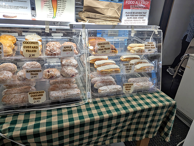 Pastry perfection behind glass—where diet plans go to die and Pennsylvania's sweet tooth traditions continue to flourish one filled donut at a time.