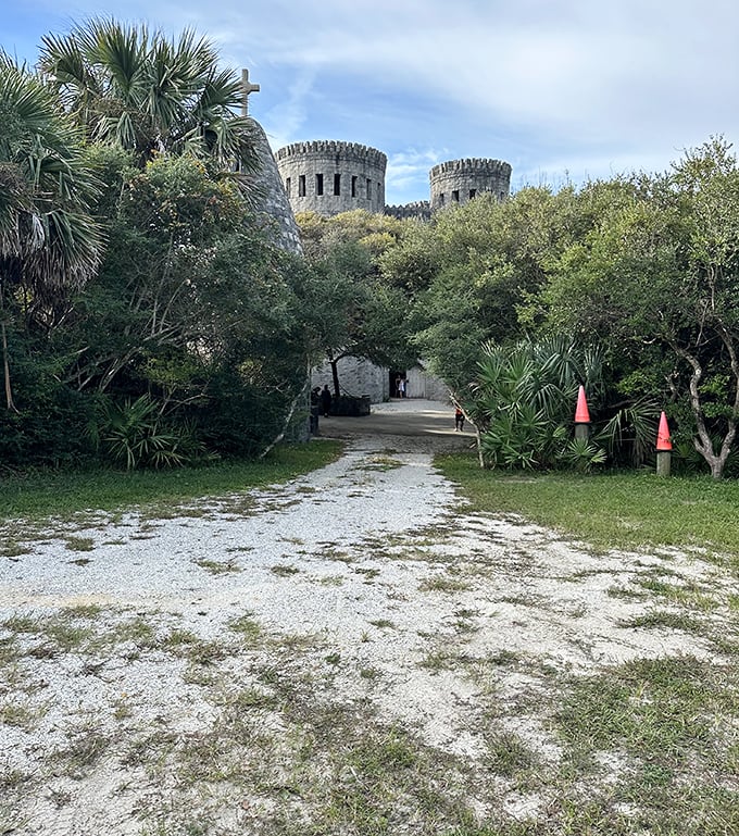 The approach to Castle Otttis feels like a pilgrimage through Florida wilderness, with twin towers emerging like a vision among the palms.