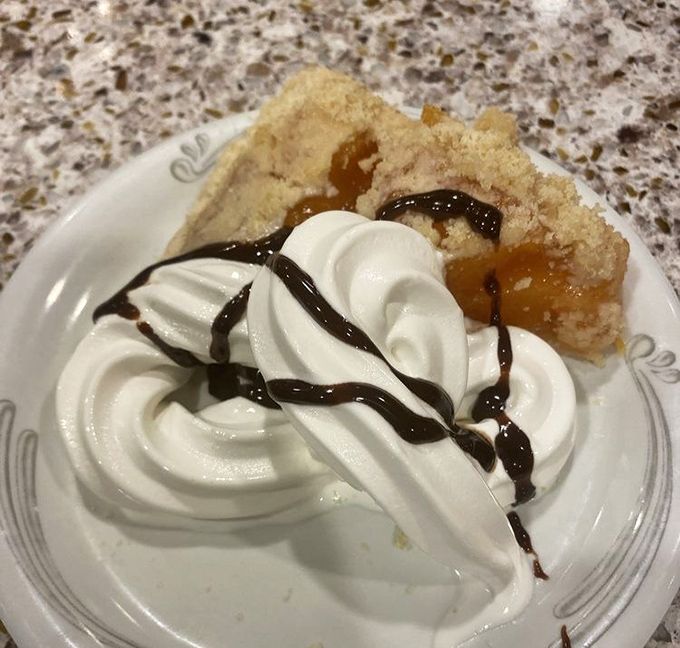This isn't just dessert—it's therapy in pie form. The perfect marriage of fruit, crust, and that magical crumbly topping that dreams are made of.