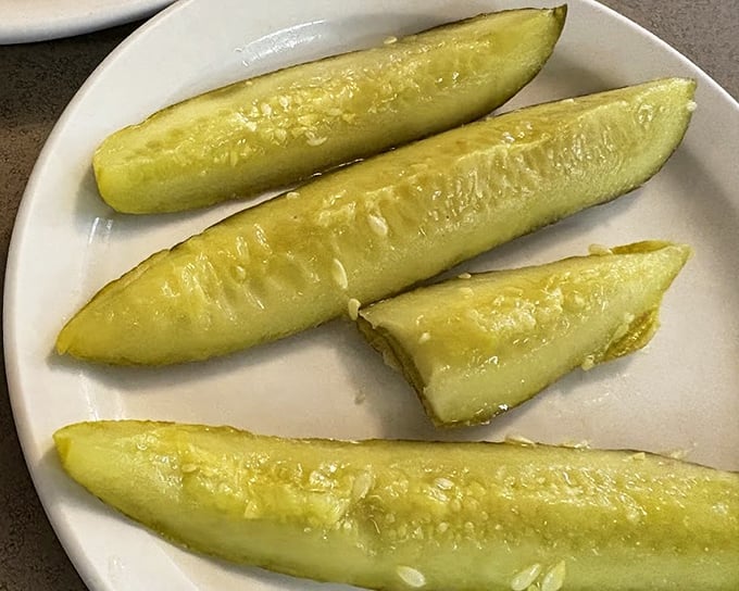 These aren't just any pickles – they're the perfect acidic counterpoint to the rich sandwiches. The unsung heroes of the deli experience.
