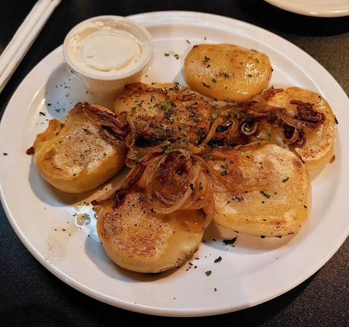 Pierogi perfection: golden-brown potato pillows topped with caramelized onions that would make any Polish grandmother nod in approval.