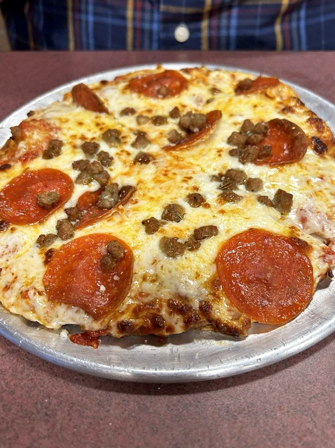 This personal pizza with pepperoni and ground beef isn't trying to be artisanal or fancy—it's just trying to make you happy. Mission accomplished.