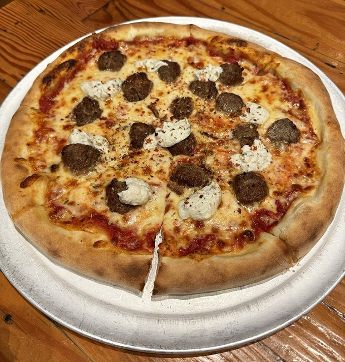Pizza perfection isn't just about the crust (though this one's magnificent)—it's about balance, from sauce to those pillowy ricotta clouds.