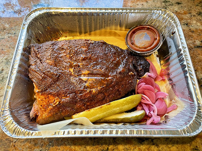 Behold: meat candy in its natural habitat. Those pink pickled onions aren't just garnish—they're essential supporting characters in this smoky drama.