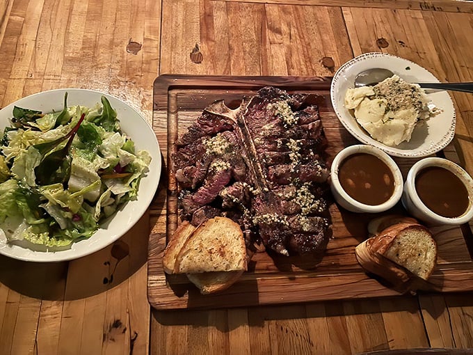 A porterhouse presented like the work of art it is—perfectly seared, expertly sliced, accompanied by sides that know their supporting role.