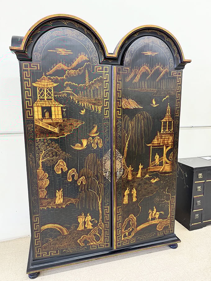 This isn't just furniture—it's functional art. The intricate Asian-inspired cabinet would make even the most minimalist decorator reconsider their life choices.