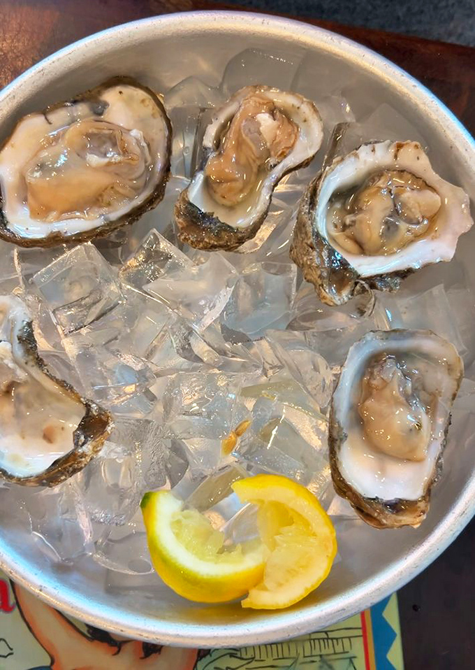 Fresh oysters on ice, glistening like pearls from Neptune's jewelry box - slurp responsibly, friends.