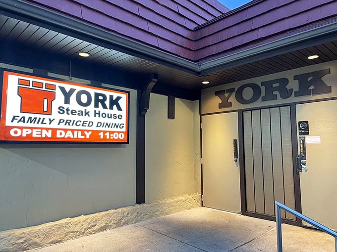The rear entrance sign promises no pretension—just follow the arrow to one of Columbus's most enduring dining institutions and prepare for meat-induced happiness.