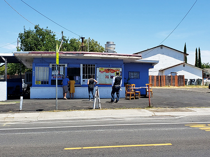 From the street, it looks unassuming—but locals know this blue building houses flavor bombs waiting to detonate.