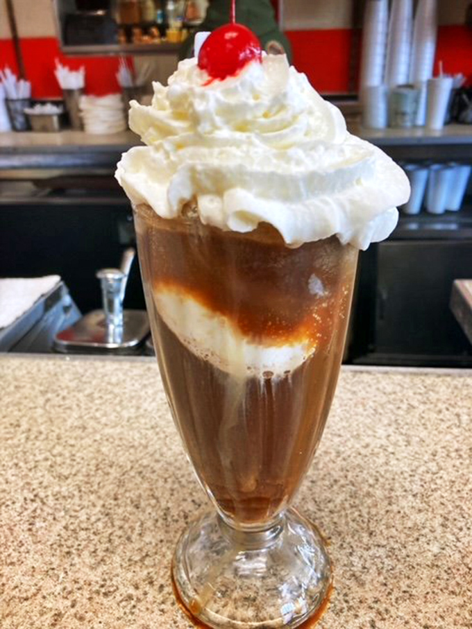 The root beer float – where fizzy meets creamy in a tall glass of nostalgia that tastes exactly like the best summer day of your childhood.