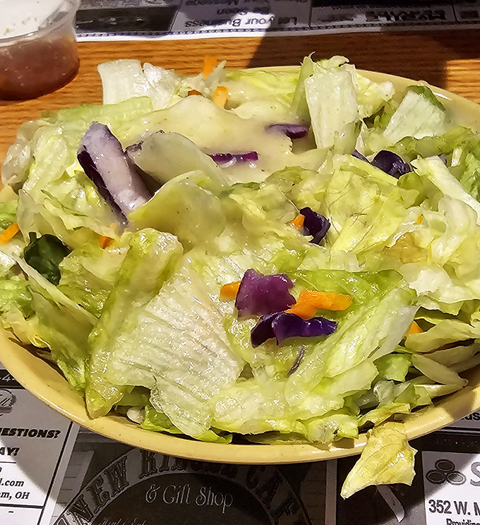 A simple salad that knows its role—providing the illusion of healthfulness before you dive back into those legendary ribs and chicken.