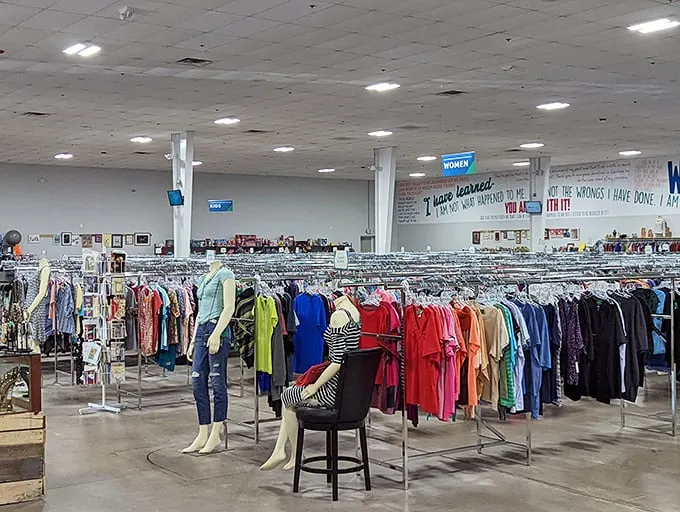 The women's clothing section stretches toward the horizon. Mannequins stand like sentinels, showcasing possibilities among the color-coordinated racks.