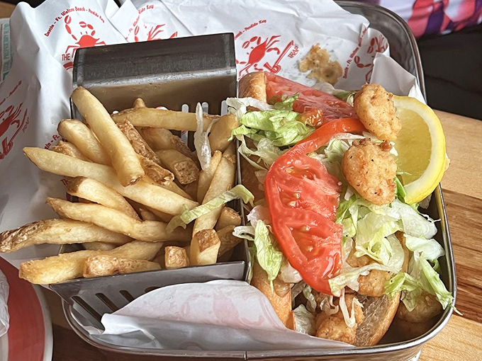 The po'boy: a sandwich so good it deserves its own theme song, with crispy shrimp spilling out like they're making a break for the ocean.