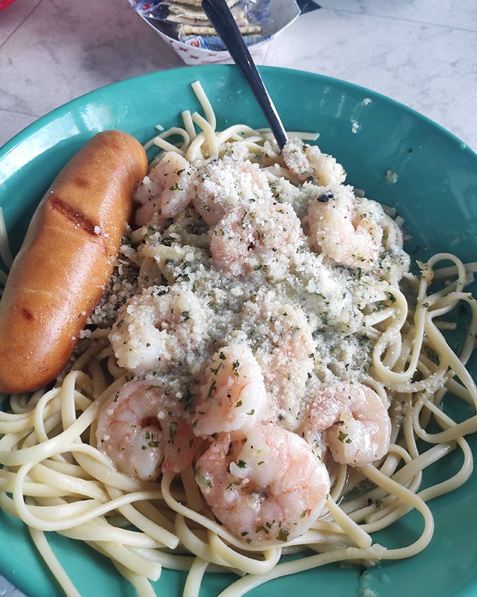 Shrimp scampi pasta where garlic and butter create the sauce of your dreams. That garlic bread on the side isn't just carbs—it's a necessary sauce-delivery system.