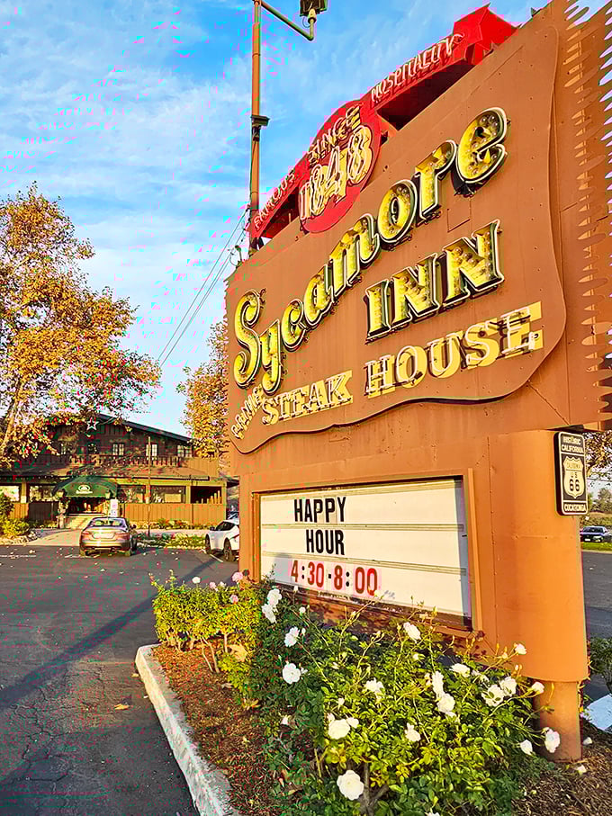 The vintage sign glows like a beacon for hungry travelers, its "Happy Hour" announcement perhaps the two most beautiful words in English.