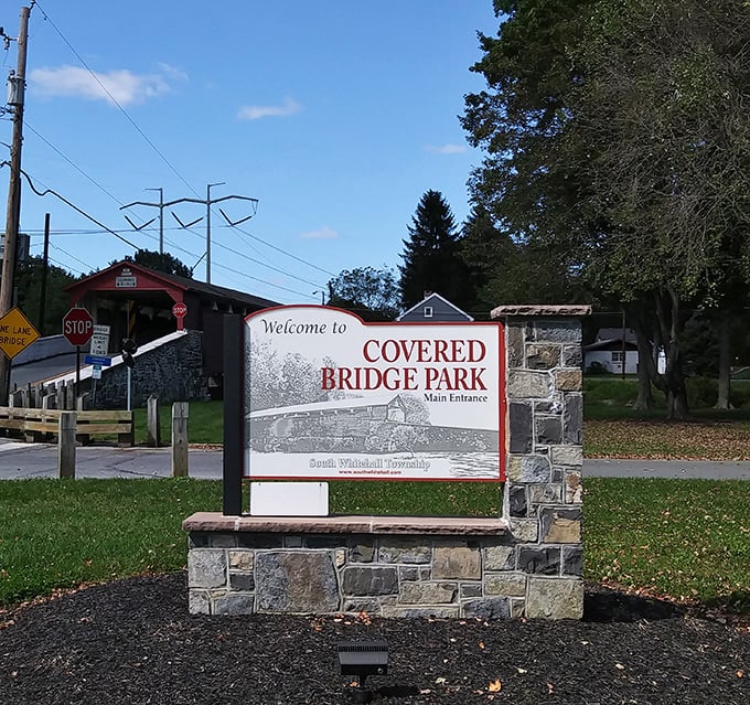 "Welcome to Covered Bridge Park"—a sign that promises exactly what it delivers, unlike those "World Famous" roadside attractions that leave you wondering why.