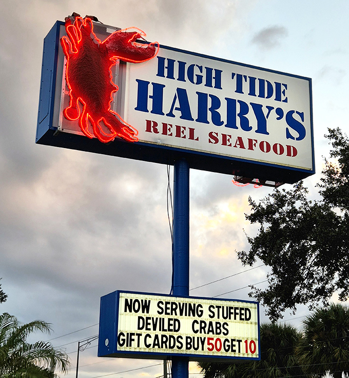 The neon crab sign doesn't just announce your arrival—it beckons like a lighthouse guiding hungry sailors to safe harbor.
