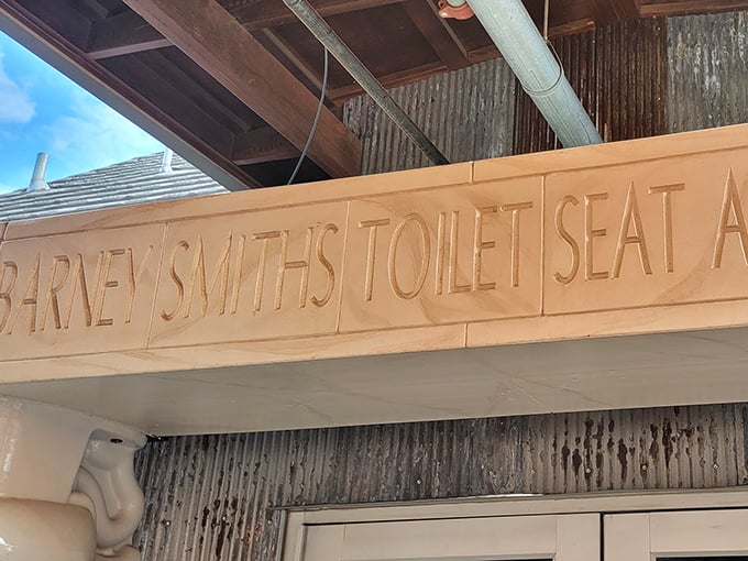 The carved stone sign announces your arrival at toilet seat nirvana. No mistaking where you've landed when you see this entrance marker.