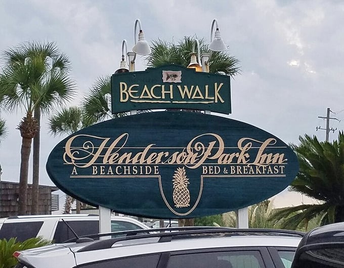 The sign announces two treasures in one location—a beachside inn and the restaurant that makes locals willing to battle tourist traffic for dinner.