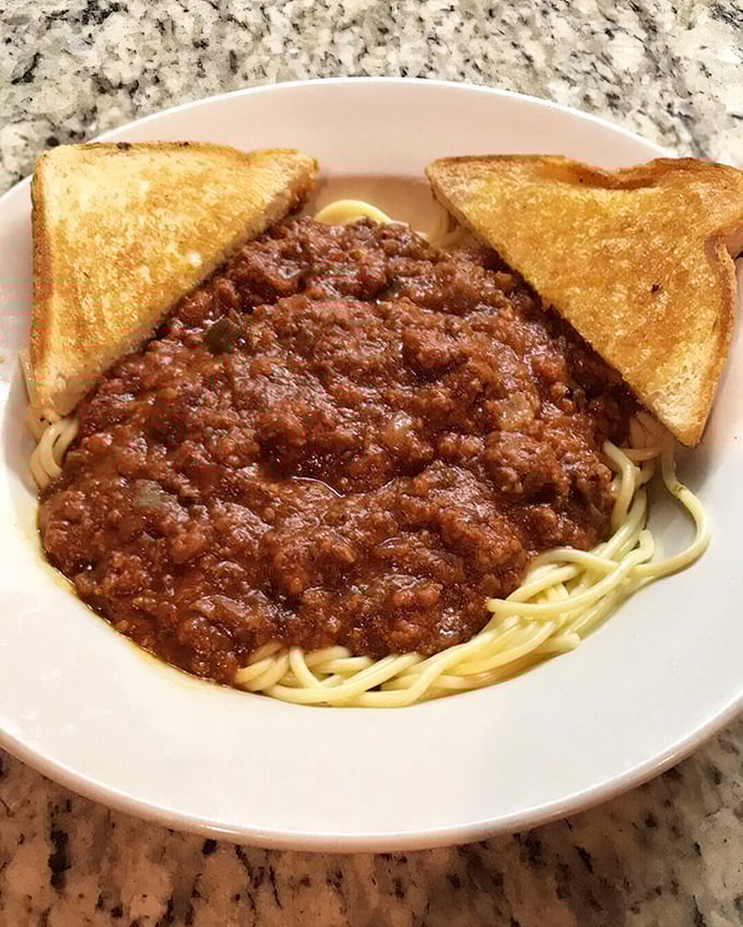 Spaghetti with meat sauce and toast—comfort food that doesn't need a passport to prove its worth.