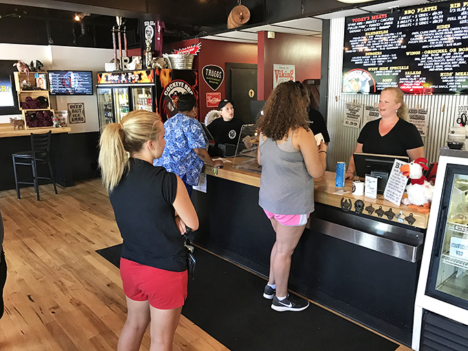 The front counter—where barbecue dreams are ordered, packaged, and handed over by folks who understand the gravity of their mission.